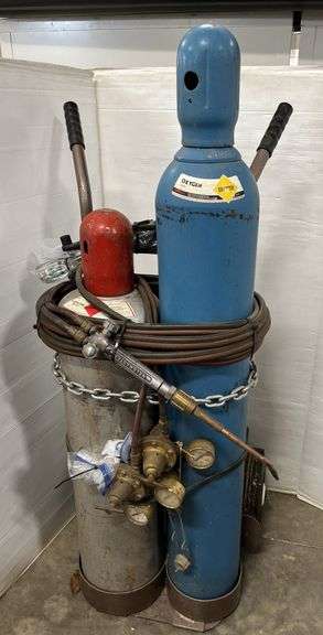 Oxygen-Acetylene tank set with hoses, nozzle, and cutting head, pulled ...