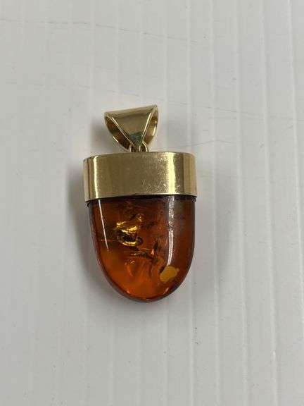 Believed to be baltic amber set in 14K gold, 8.3g, 7/8"W x 1 1/2"L ...