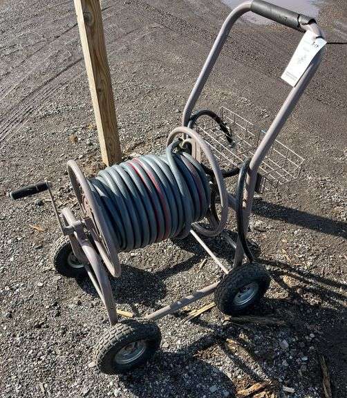 Rolling hose reel with hose, good - Albrecht Auction Service