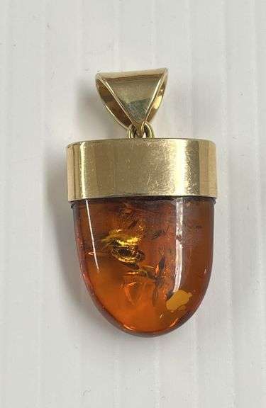 Believed to be baltic amber set in 14K gold, 8.3g, 7/8"W x 1 1/2"L ...