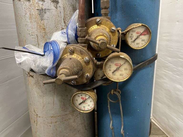 Oxygen-Acetylene tank set with hoses, nozzle, and cutting head, pulled ...