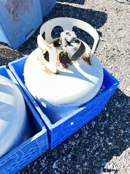 (2) Propane tanks in sturdy milk crates, one about 1/2 full, one about ...