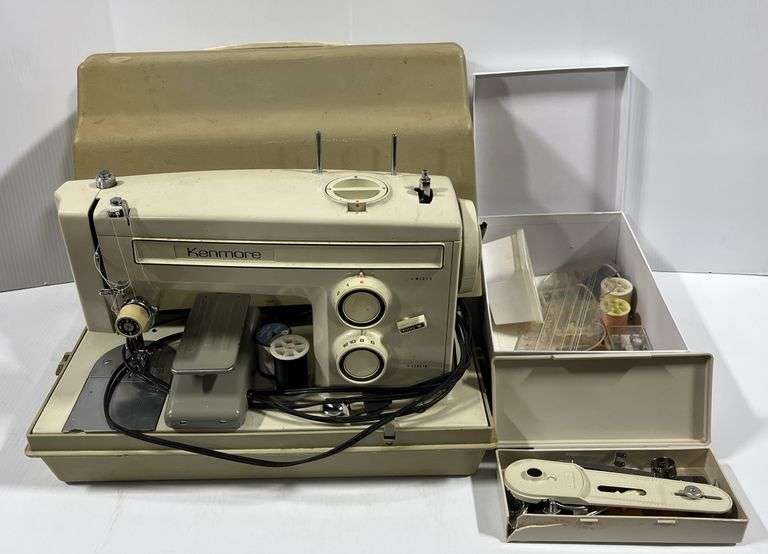 Older Kenmore sewing machine, lots of accessories included and manual ...