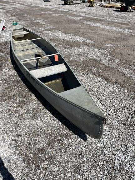 Canoe 17', made by Delhi Mfg. with one paddle, two seater, needs paint, capacity 5 people, has ...