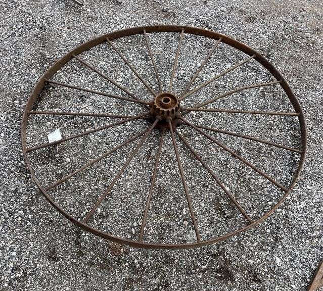Antique steel wheel, 56"H, used, rusty - Albrecht Auction Service