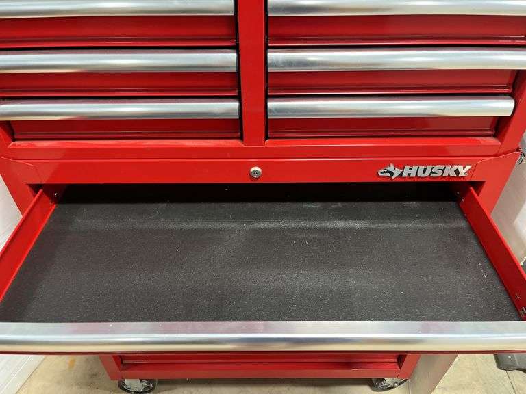 Husky tool boxes, top box with six drawers and power strip, and a ...