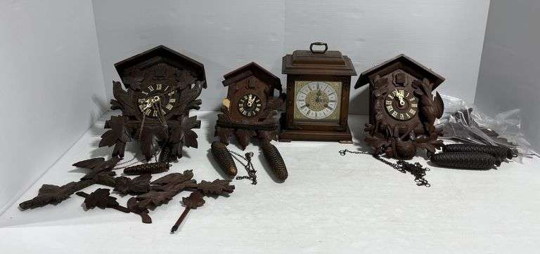 (3) Cuckoo Clocks, and (1) 25 Year Fisher Body Mantel clock, for parts ...