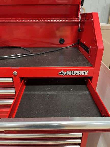 Husky tool boxes, top box with six drawers and power strip, and a ...
