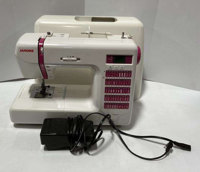 Janome DC2011 sewing machine, comes with six different feet, some bobbins, front drawer is taped ...
