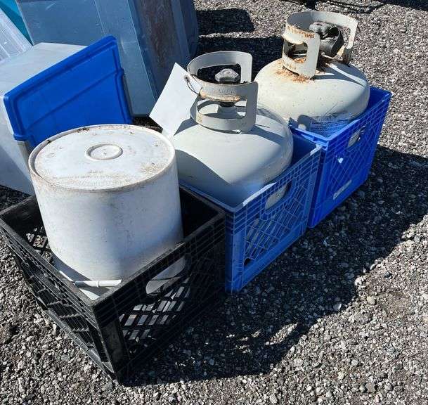 (2) Propane tanks in sturdy milk crates, one about 1/2 full, one about ...