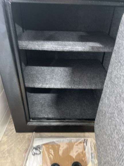 Sentry Safe, combination included in envelope attached to front door ...