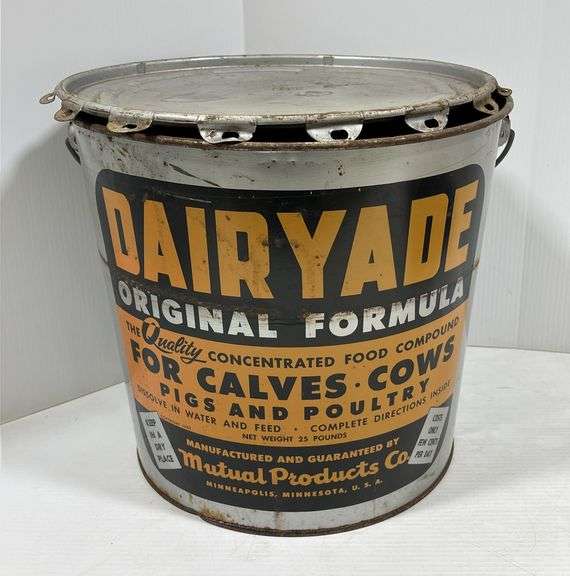 25 lb. Tin can of Dairyade animal feed with lid and handle, 12"H, empty ...