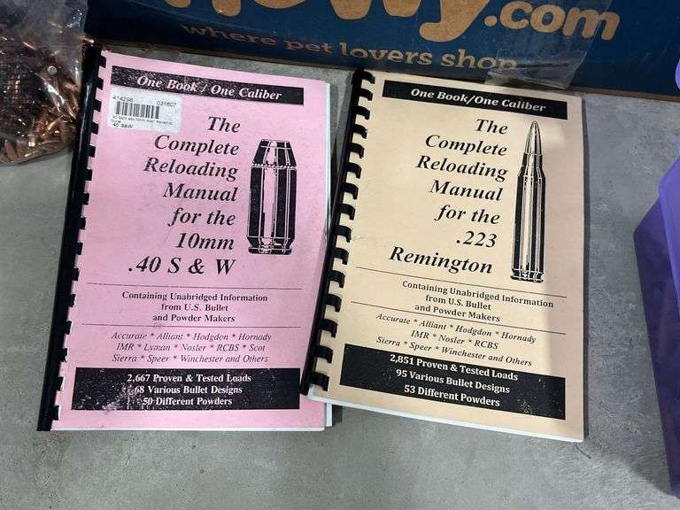 Box of .223 reloading equipment and manuals, dies, points, and remer ...