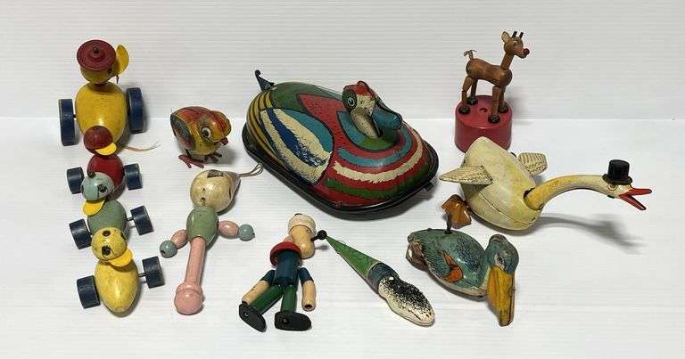 (9) Older toys, include: Colorful lithograph wind-up metal duck toy ...