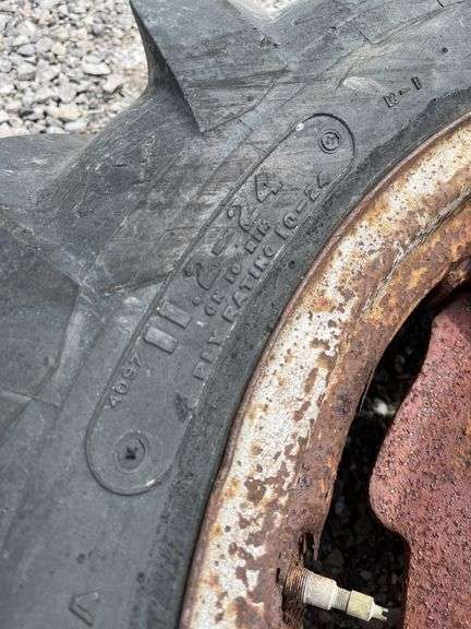 24" Rear tractor wheel with poor tire, 11.2 x 24, rim needs repair ...