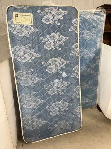 (2) Twin blue mattresses, one in plastic, used for a bunk bed, one in ...