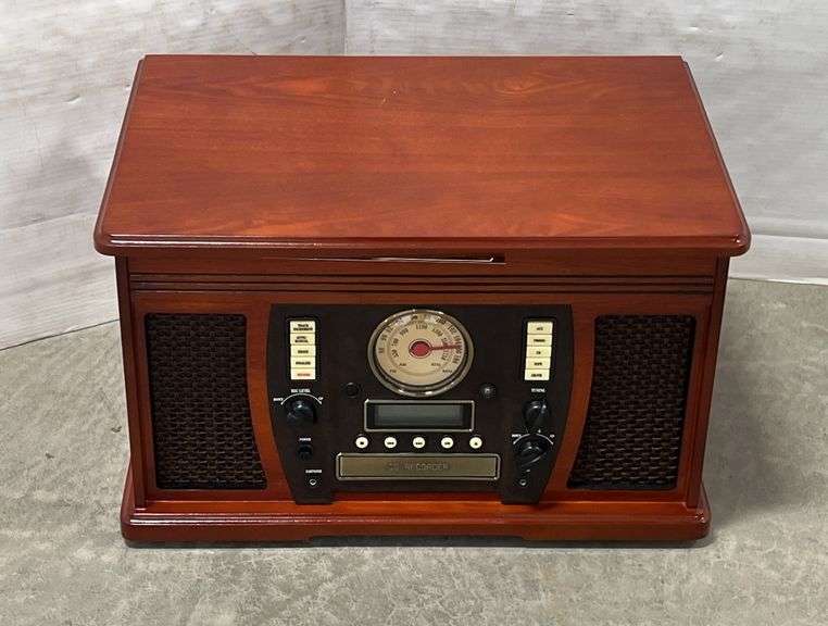 Victrola AM/FM record player, cassette and tape player, and 3-CD ...