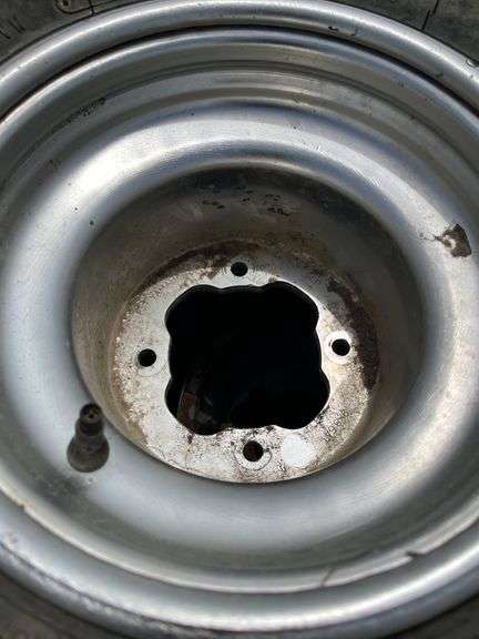 (7) Tires: One- 5-Lug Dodge truck rim, One- 8-Lug Ford truck rim, Two ...