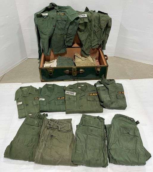 Army green trunk with original US Army button up shirts with patches ...