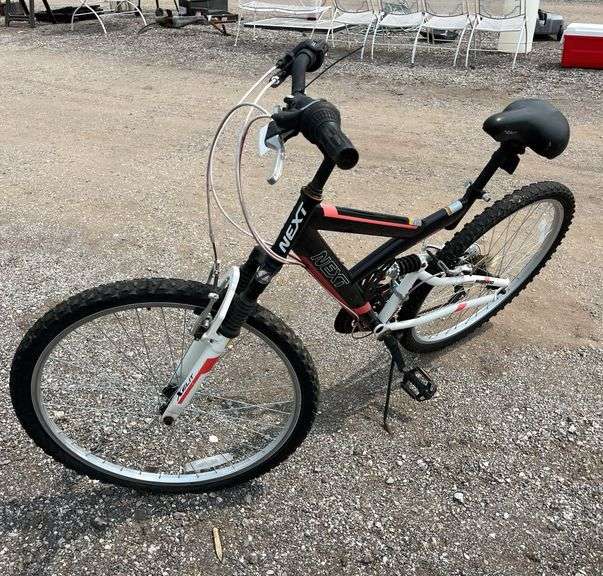 Next PX 6.0 12-speed bike, 26", has a flat tire - Albrecht Auction Service