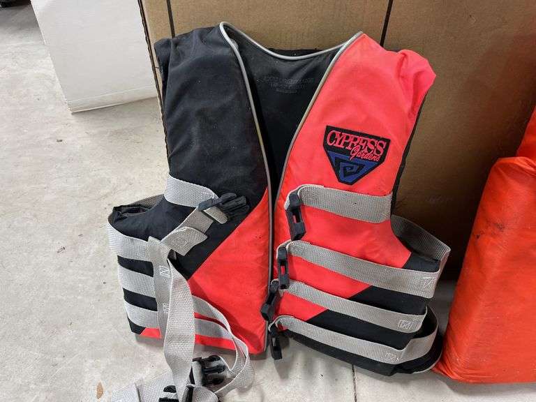 Boat accessories, include: Life jackets, tie-down ropes, and an anchor ...