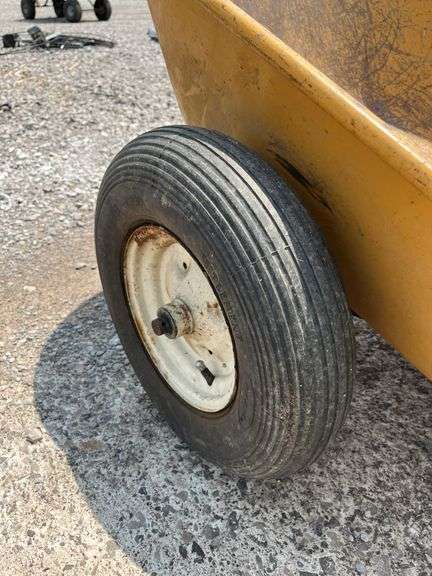 Older solid metal tow-behind wheelbarrow dump cart with two wheels, 27 ...