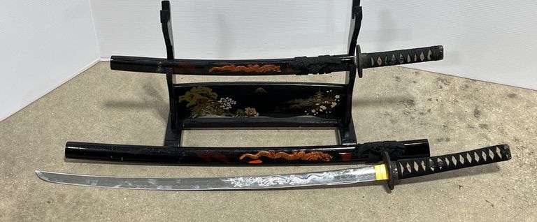 Set of oriental decorative swords with dragon sheaths and a stand, up ...