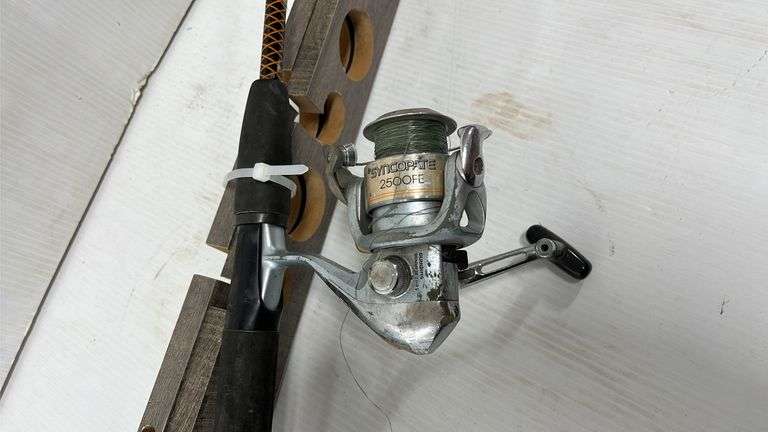 Shakespeare Ugly Stik fishing rod with Shimano 2500 FE reel and wall ...