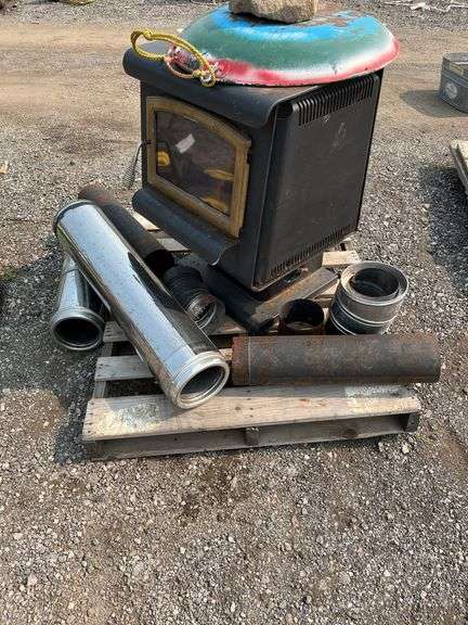 The Earth Stove, disassembled on two pallets, parts include: Stove, 27 ...