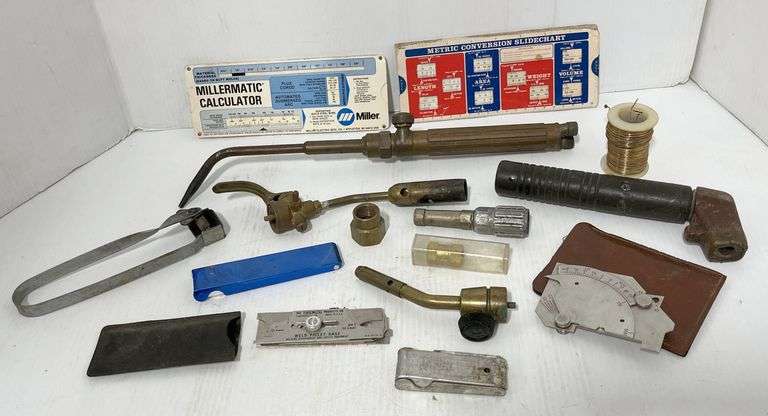 Various older welding equipment, includes: Rod holders, torch body, and ...