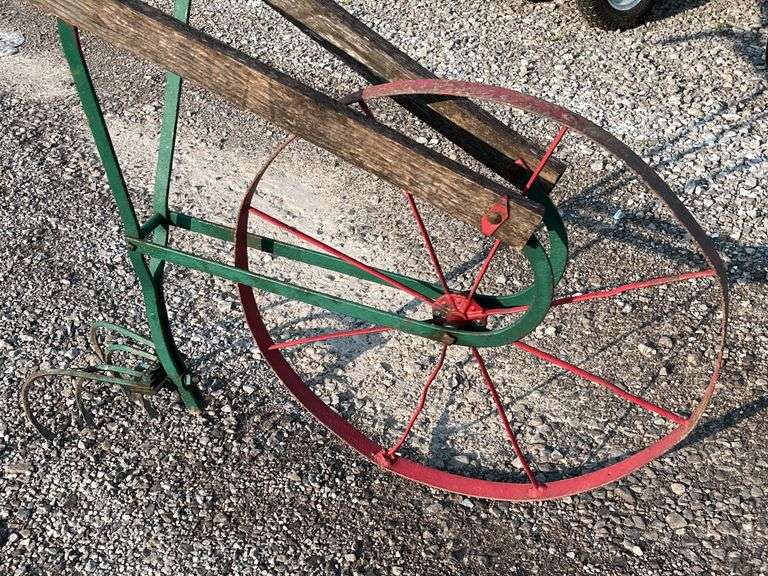 Push cultivator with 24" wheel - Albrecht Auction Service