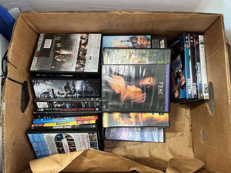 Various DVDs in a box and a tote, used - Albrecht Auction Service