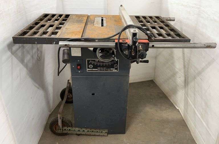 10" Table saw, 1 1/2 HP, cast iron surface with spare blades and tools ...