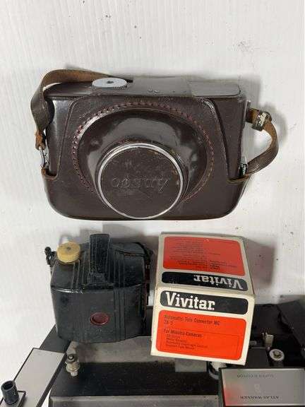 Antique cameras, video recorders, and binoculars, up to 9 1/2"L ...
