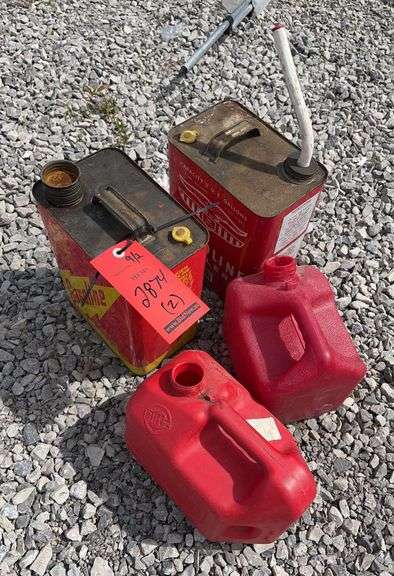 (2) 2-Gallon gas cans, and (2) 1-Gallon plastic gas cans, used ...