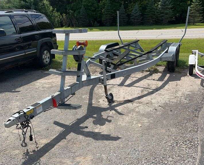 Boatmate 27' boat trailer with a spare wheel, used to haul a 22' wake ...