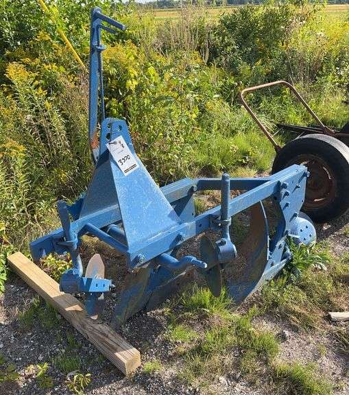 2-Bottom plow Ford, 12" disc, good shape - Albrecht Auction Service