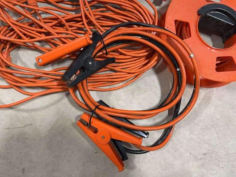 Assorted electrical wire, jumper cables, extension cords, and rell ...