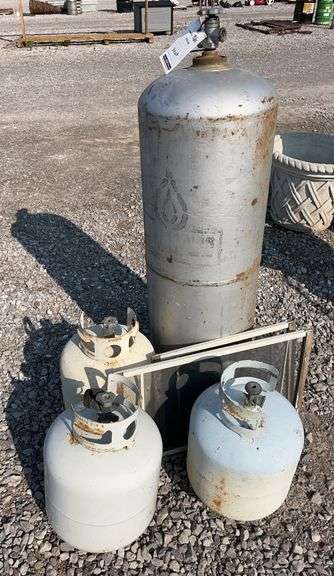 (4) Propane tanks and (2) Older screens, tanks- 3- 20 lb. 1- 100 lb ...
