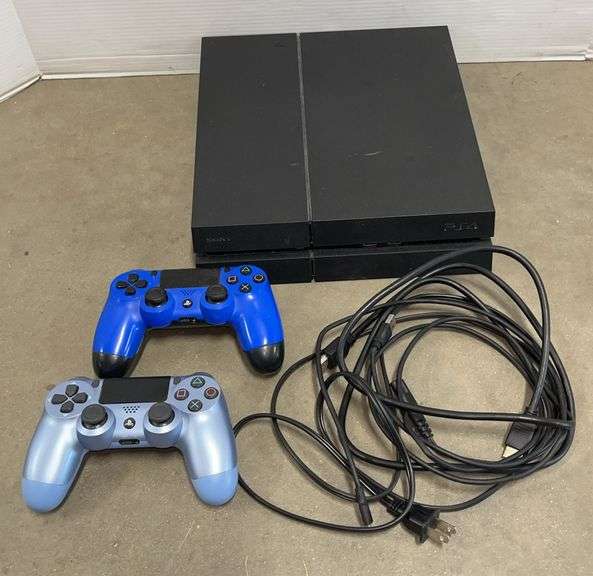 Playstation 4 with (2) Controllers , controller charging cable, and ...