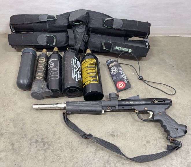 Tippmann Pro-Lite paintball gun, (4) C02 tanks, and ammo harness ...