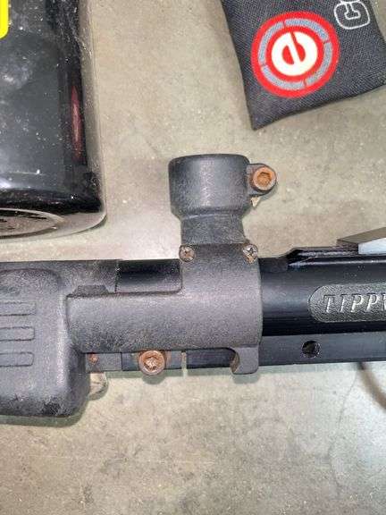 Tippmann Pro-Lite paintball gun, (4) C02 tanks, and ammo harness ...