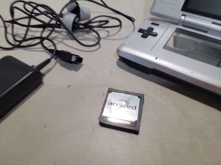 Nintendo DS With Charger And Ace Card Works - Auction Ohio