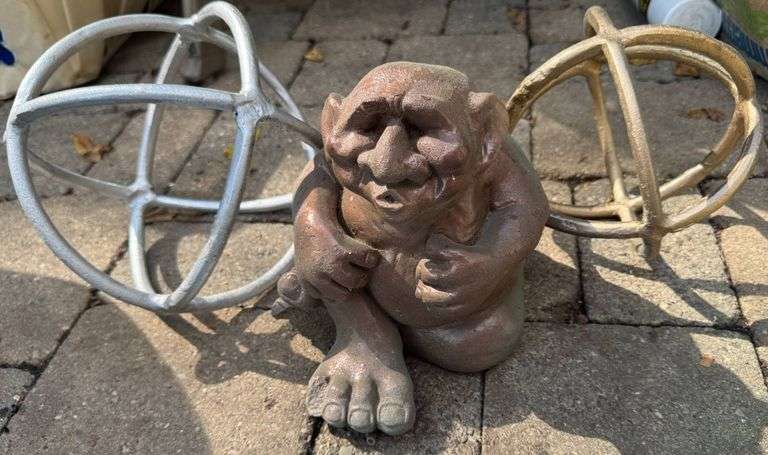 Cast Iron Troll Figurine with Two Metal Spherical Objects - Auction Ohio