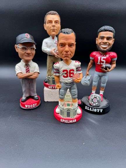 Four Ohio State University-Themed Bobbleheads Featuring Figures on Red ...