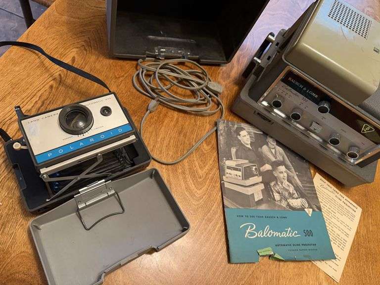 210 Polaroid camera + B&L slide projector - Auction Ohio
