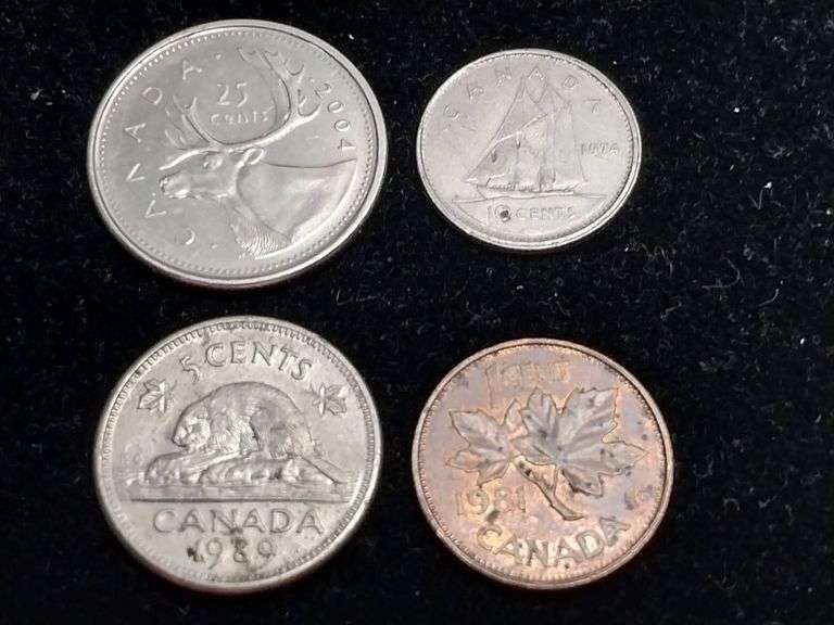 Four Canadian Coins: 2004 Quarter, 1974 Dime, 1989 Nickel, and 1981 ...