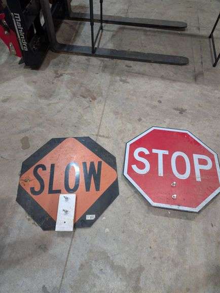 Octagonal Traffic Signs Featuring ‘Slow’ and ‘Stop’ - Auction Ohio