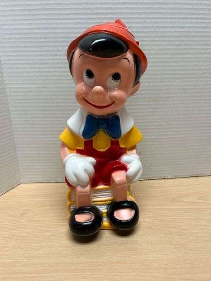 Pinocchio Plastic Figurine Bank Seated on Books with Red Hat and Blue ...