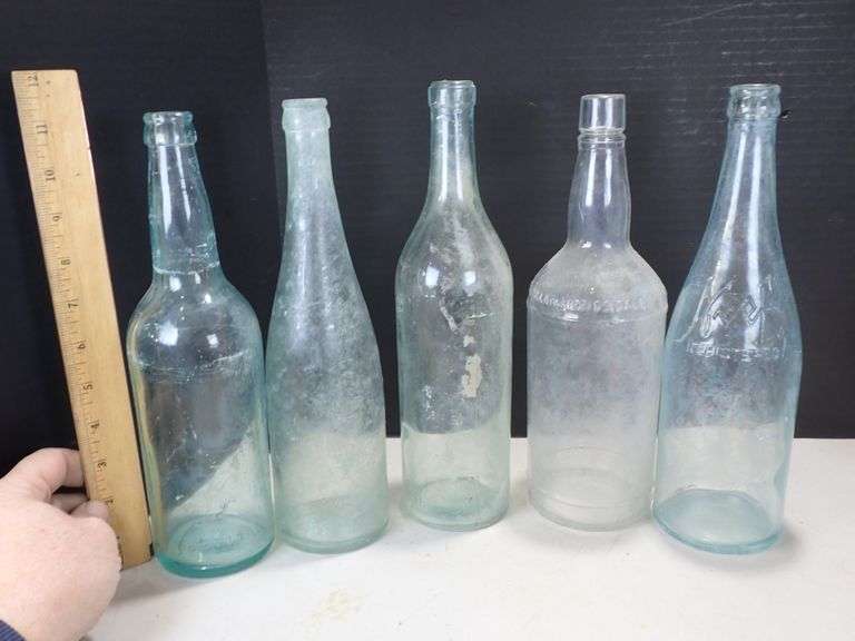 Five Antique Privy Dug Glass bottles w/rainbow Hue - Auction Ohio